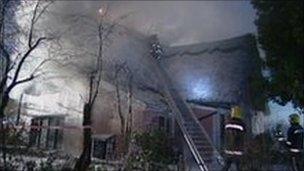 Firefighters remain at Suffolk house fire - BBC News