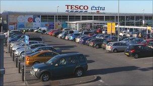 Swansea Tesco Welsh-English signs to different exits - BBC News
