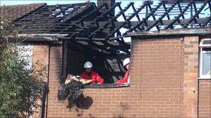 Woman dies after being rescued from Telford house fire - BBC News
