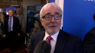 Ex-Alliance Party councillor Adam Harbinson at DUP conference - BBC News