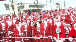 Liverpool Santa Dash: About 8,000 take part in fun run - BBC News