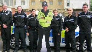 Cardboard cut-outs of police tackle theft in Berkshire - BBC News