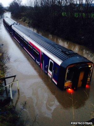 Passenger hurt as train hits flood in East Ayrshire - BBC News