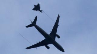 RAF jets escort plane to Birmingham airport - BBC News
