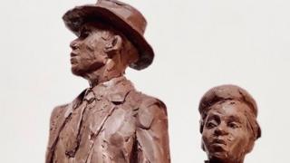 Windrush Day: Queen praises pioneers as Waterloo statue unveiled - BBC News