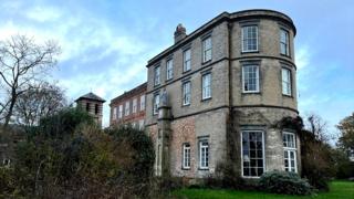 The Suffolk manor house where 60 people live together - BBC News