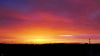 Spectacular pink and orange sunset lights up sky - BBC News