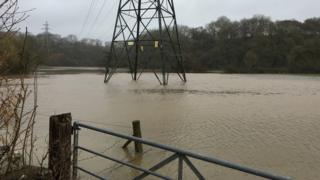 Wales suffers floods and power cuts as wind and rain hits - BBC News