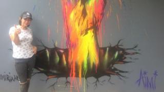 Luton mural repainted after accidental cover-up - BBC News