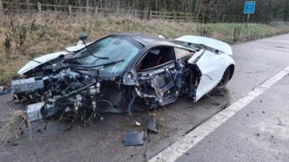 McLaren crashes and bursts into flames on M54 - BBC News