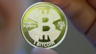 Bitcoin drops more than 10% after security breach - BBC News