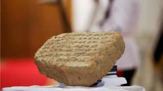 Iraq: displays 2,800-year-old stone tablet returned by Italy - BBC News