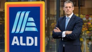 Aldi reports record sales but profits drop amid price war - BBC News