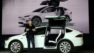 Electric carmaker Tesla announces new model as sales rise - BBC News