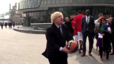 Boris Johnson tackles child at football match press event - BBC News