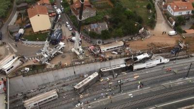 Spain train crash: Aerial images show extent of wreckage - BBC News