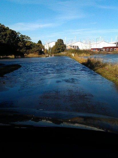 In pictures: High tides cause coastal flooding - BBC News