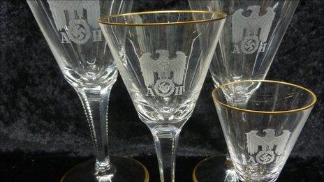 'Hitler cups' recalled in Germany over Nazi stamp - BBC News