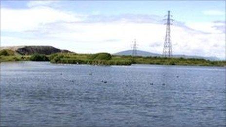 Swimmer dies after being pulled from Ormsgill Reservoir - BBC News