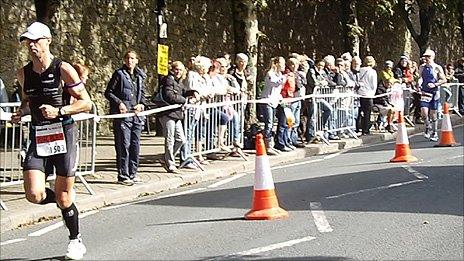 Thousands watch Tenby Ironman Wales triathlon - BBC News