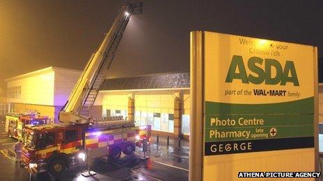 Asda in Llanelli evacuates 85 people after 'substantial fire' - BBC News