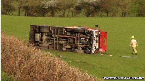 Aberdovey crew hurt as fire engine crashes on its side in field - BBC News