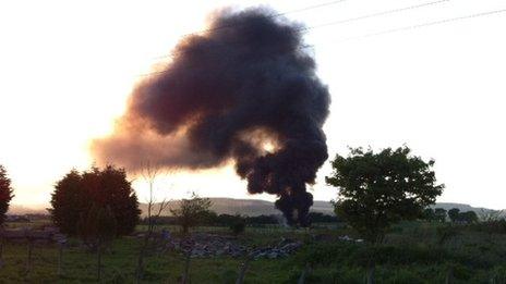 Crews tackle large portable toilet fire near Kinross - BBC News