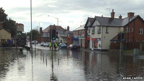 Flood-hit homes clean-up continues in Wrexham - BBC News