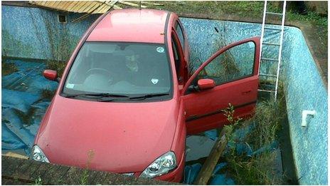 Driver, 83, crashes car into Radley swimming pool - BBC News