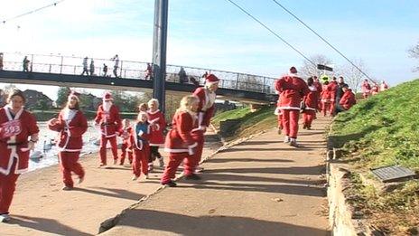 Exeter Santa runners raise cash for Dream-A-Way charity - BBC News