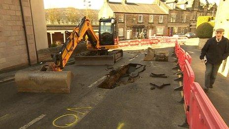 Matlock flooded as water main and gas pipe crack - BBC News