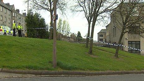 Man found injured in school grounds - BBC News