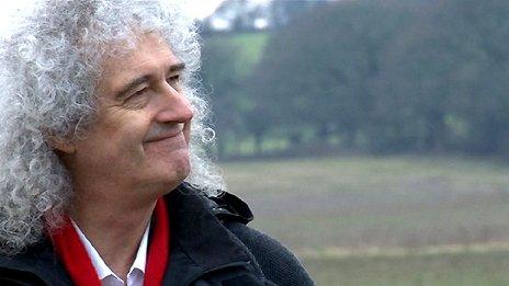 Brian May plants first tree for his Dorset woodland project - BBC News