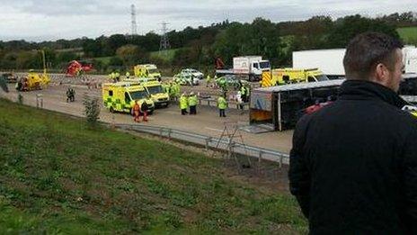 M25 closed after lorry fire damages road surface in Essex - BBC News
