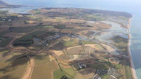 'Largest' coastal management scheme completed at Steart Marshes - BBC News