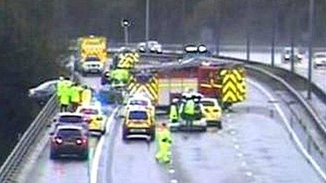 Two rescued as car hangs off M6 near Haydock - BBC News
