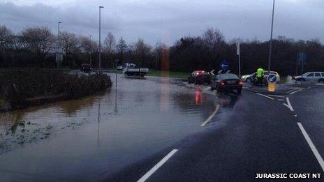 Dorset firefighters rescue 30 people from flood waters - BBC News
