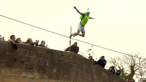 Mapleton Bridge jump: People take part in Ashbourne tradition - BBC News