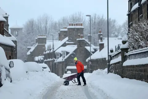 UK weather: Met Office snow warnings across UK as hundreds of schools close