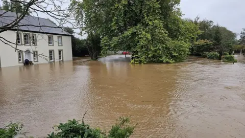Cork homes flooded during heavy rain from Storm Barbet