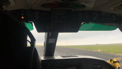 Golden plane makes special flight on Orkney anniversary - BBC News