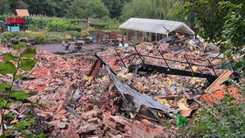 Crooked House owners' links to previous major fire - BBC News