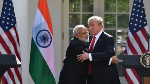 Modi's enthusiastic bear hug beats Trump's handshake