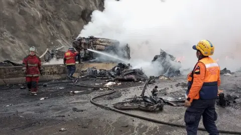 Venezuela highway in flames as lorry ploughs into crash site