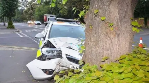 PC seriously hurt as car crashes into tree in Reading