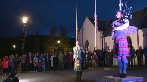 Pipers and silence mark Scotland's moment of reflection - BBC News