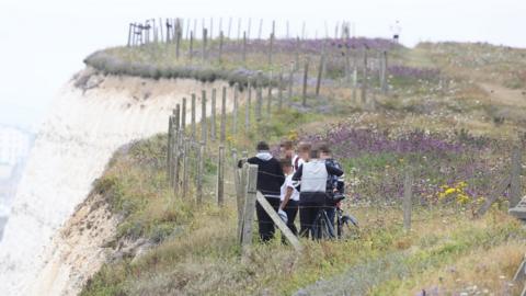 Nick Cave's son Arthur took LSD before cliff fall, inquest told - BBC News