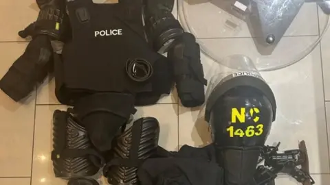 Lincoln police officer takes on 10K in full riot gear for charity