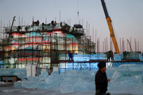 Building frozen castles at China's Harbin Ice Festival