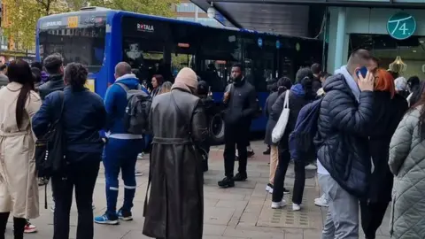 Manchester bus crash: Police continue to question man